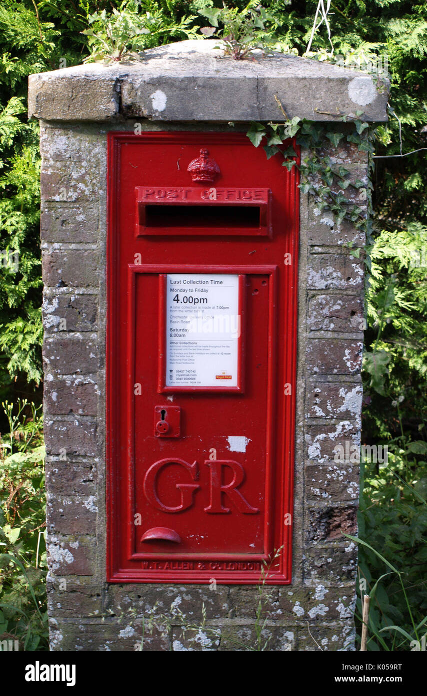 Traditional red post box on English country lane near Emsworth ...