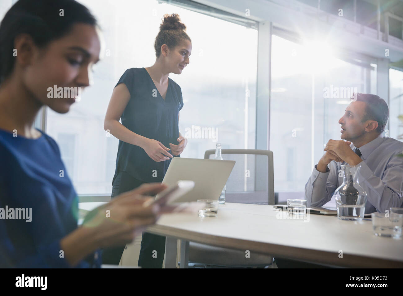 Business people talking in conference room meeting Stock Photo - Alamy