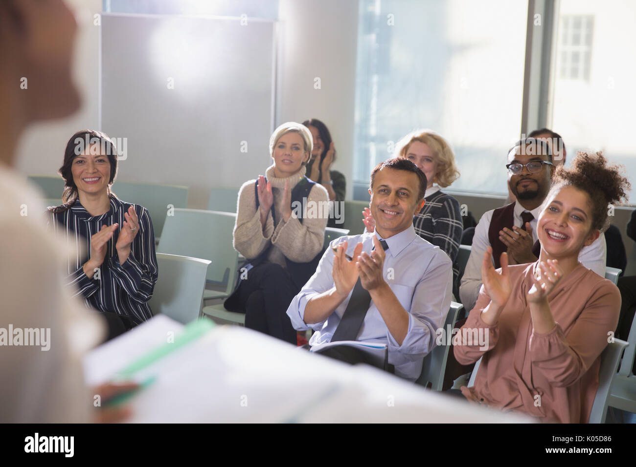 Business people in audience clapping for conference speaker Stock Photo ...