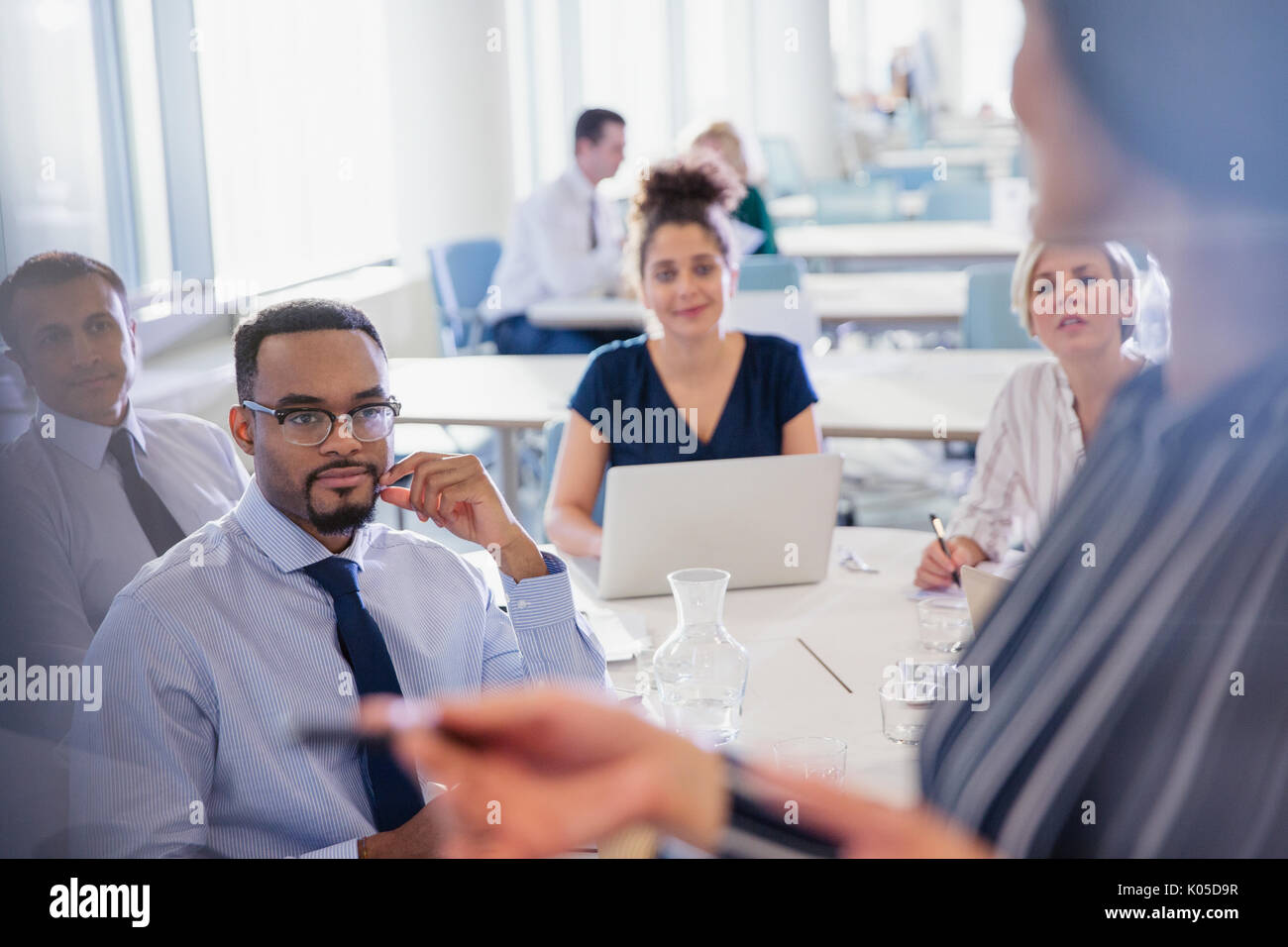 Business people listening in conference room meeting Stock Photo - Alamy