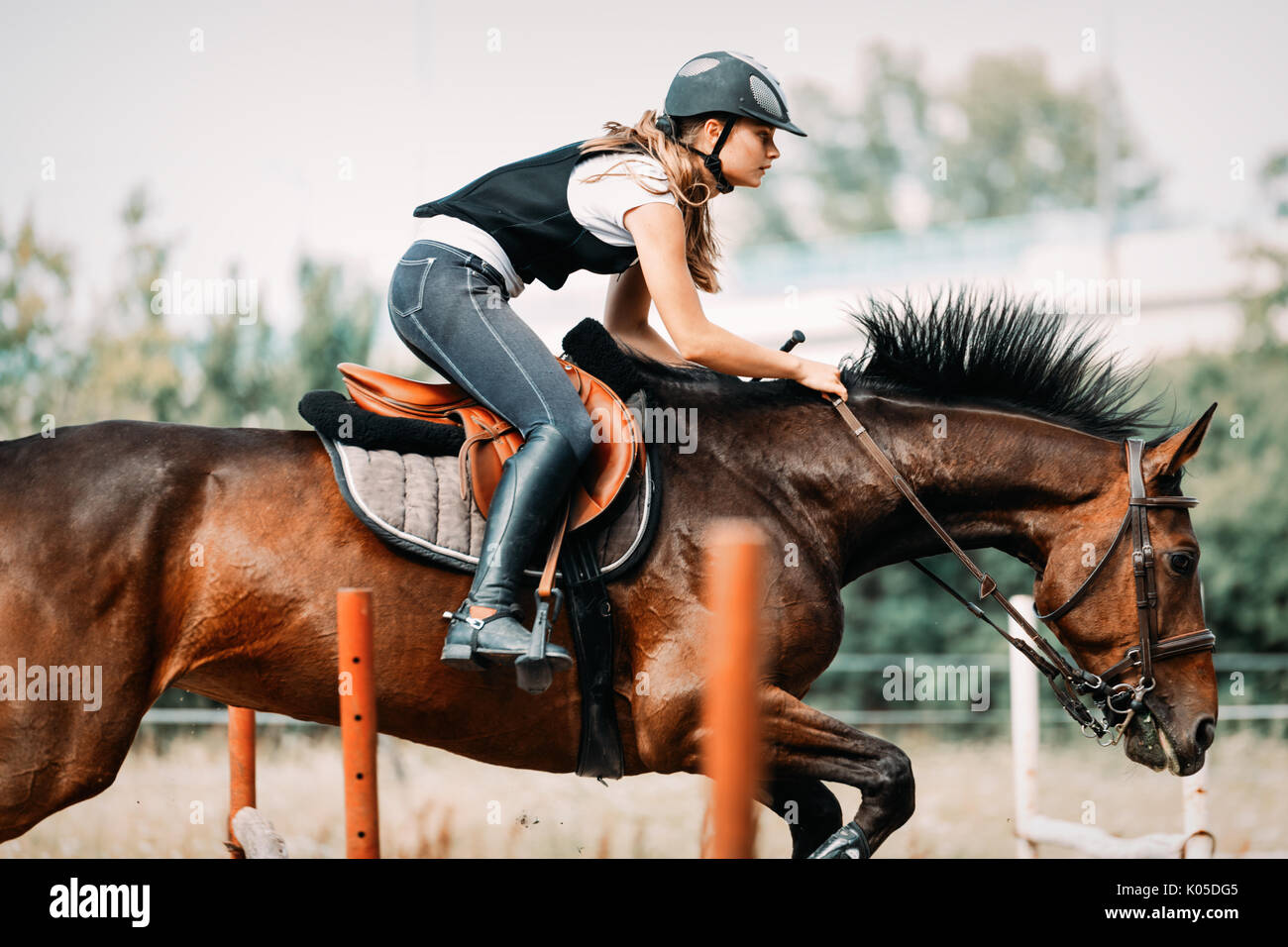 Picture of young pretty girl riding horse Stock Photo - Alamy