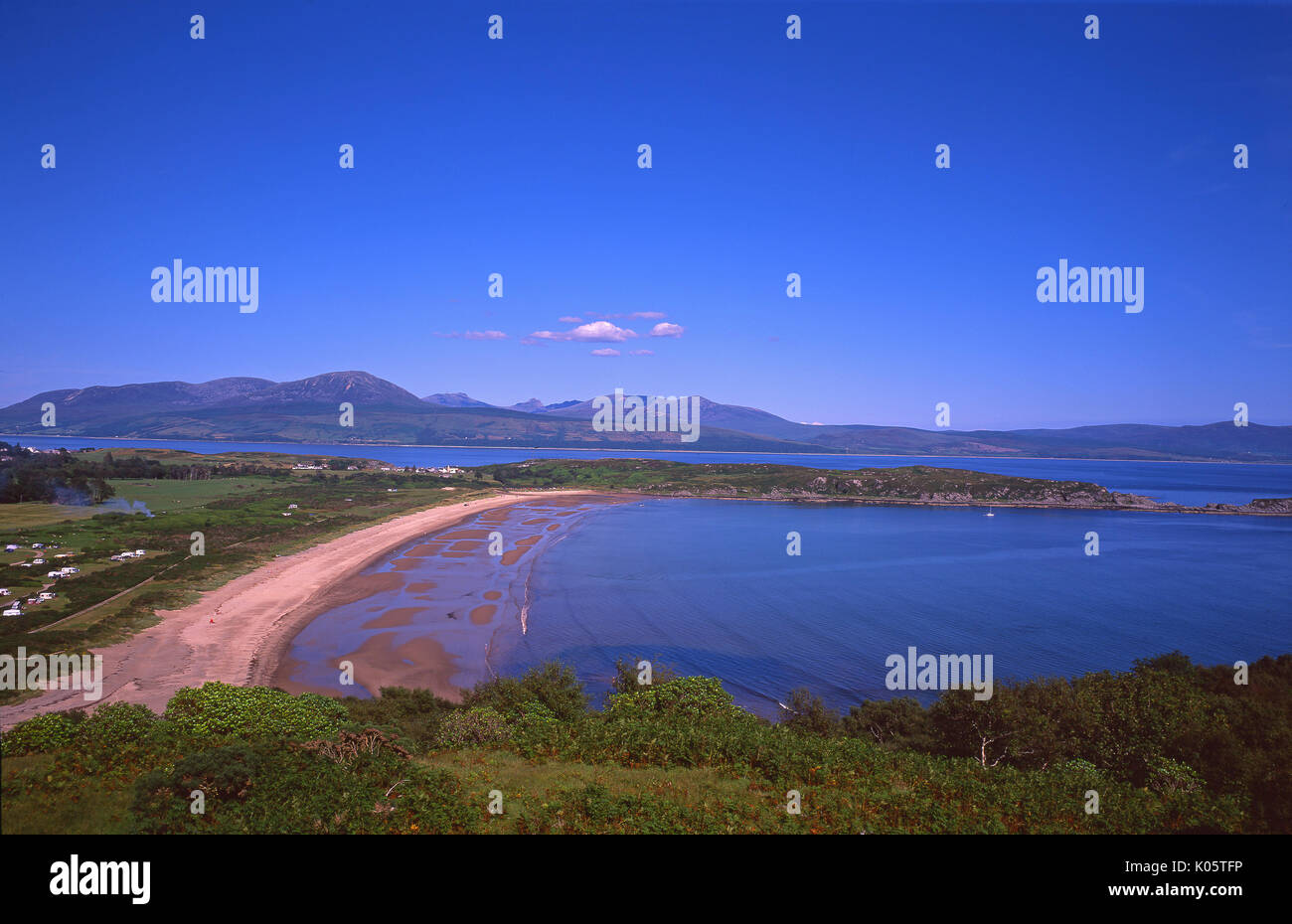 Summer view overlooking Carradale Bay with the island of Arran in the ...