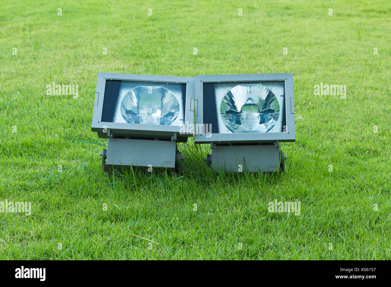 two spotlight in the green garden (football field Stock Photo - Alamy