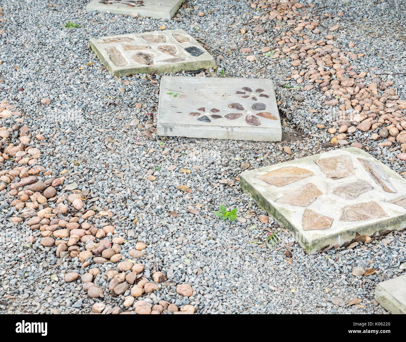 Stone block tile for the pathway on the gravel ground of the stone ...