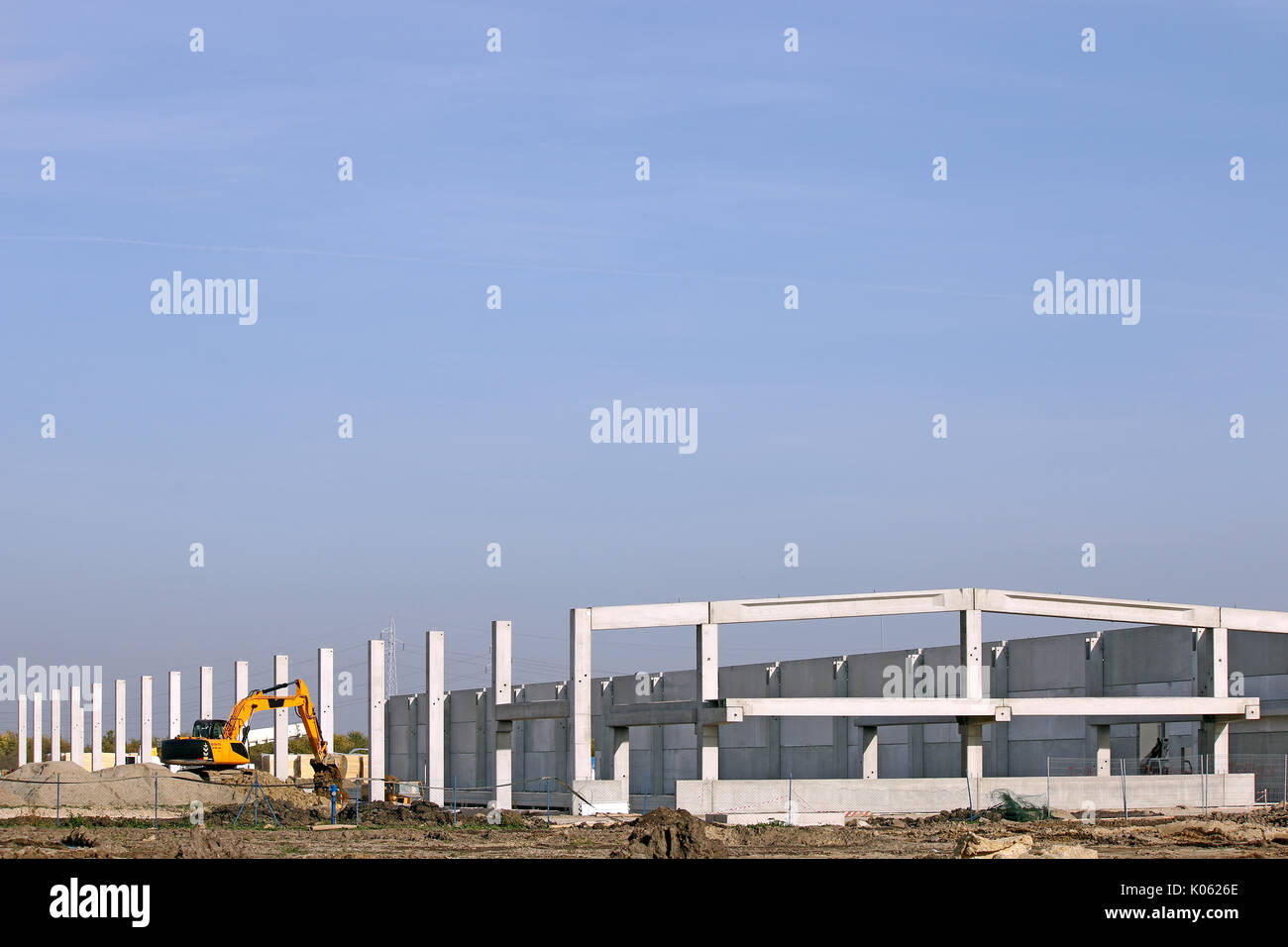 new factory construction site with excavator Stock Photo - Alamy