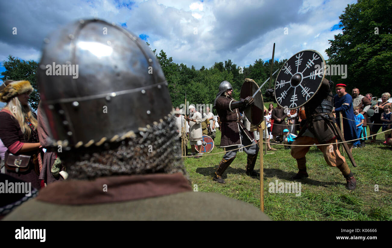 Residents of early medieval camp in historical costumes are seen in ...