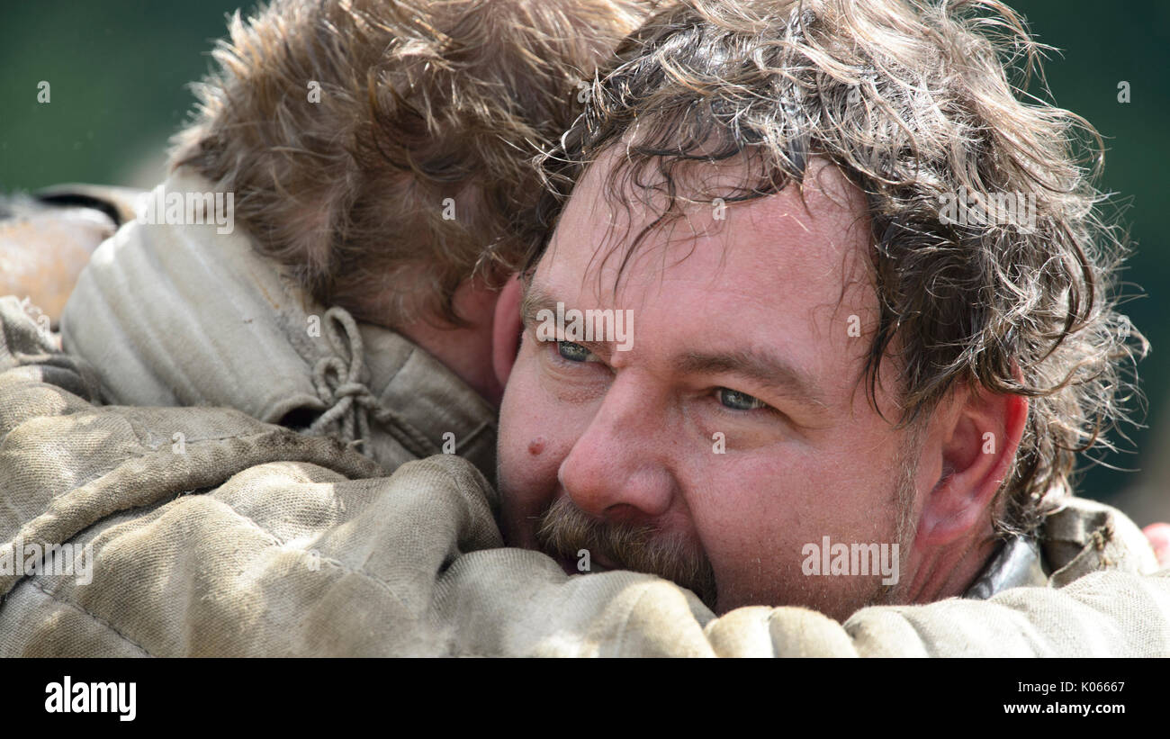 Residents of early medieval camp in historical costumes are seen in ...