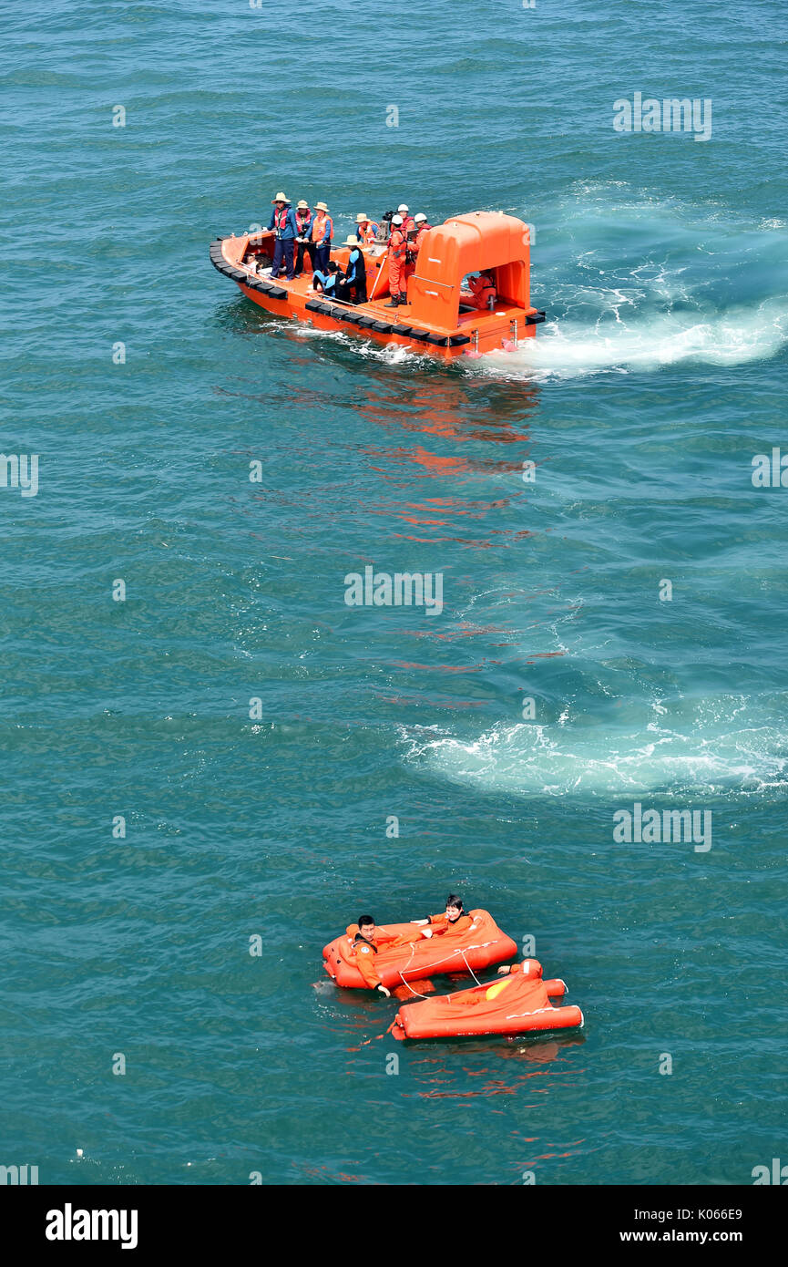 Yantai. 21st Aug, 2017. Astronauts (front) wait for rescue during a sea ...
