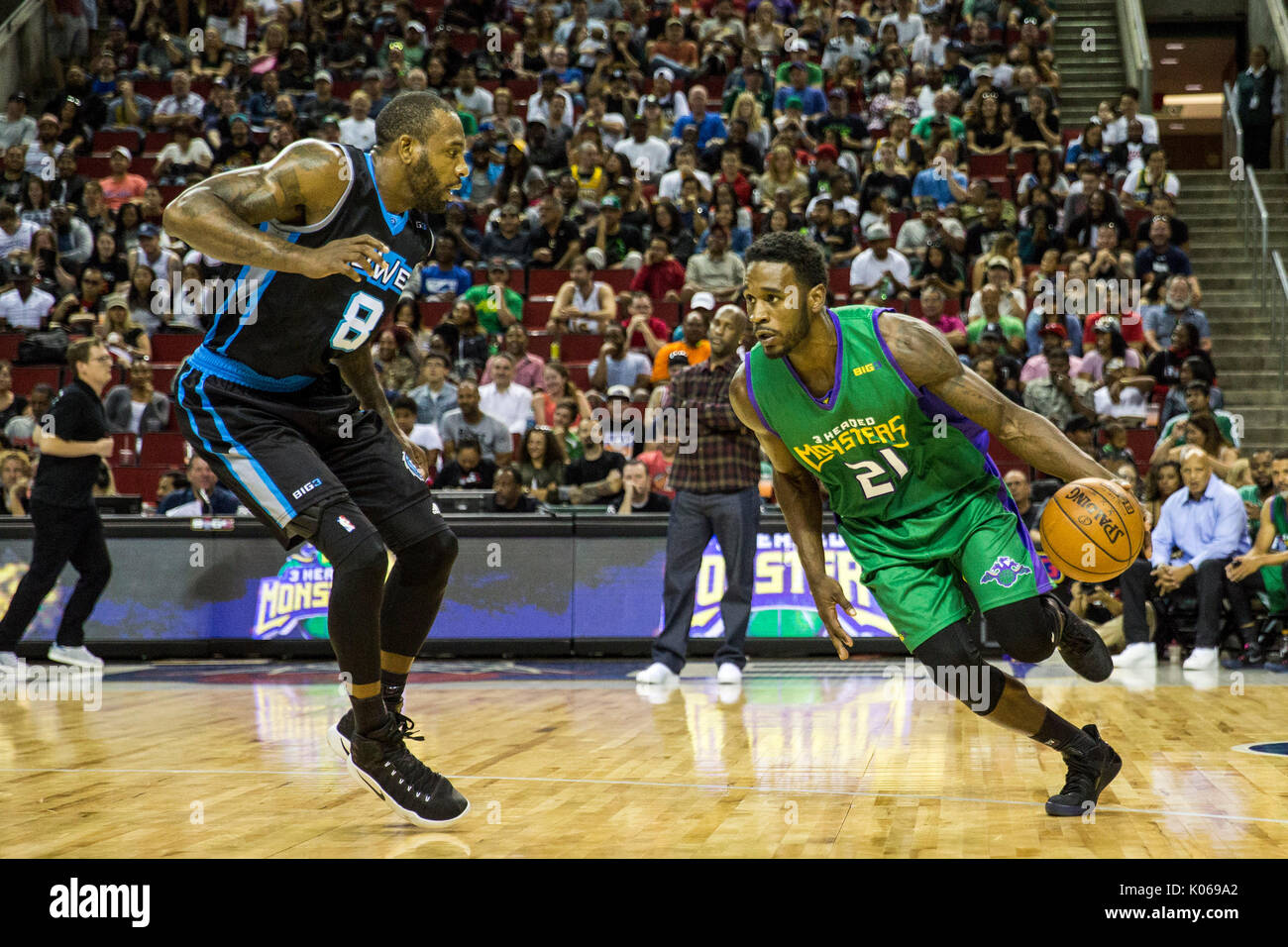 Kareem Rush #21 3 Headed Monsters pushes ball forward past Rasual ...