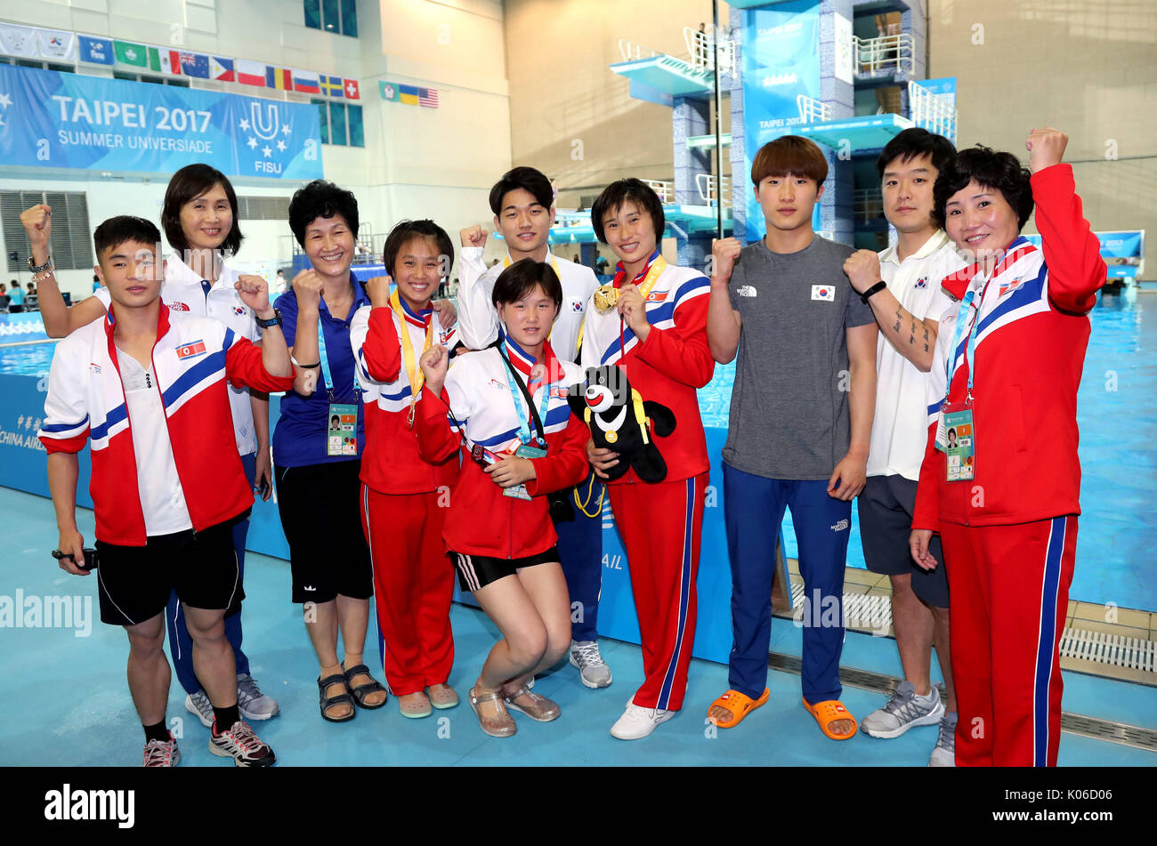 Swimmers of two Koreas Swimmers of South and North Korea pose at a pool ...