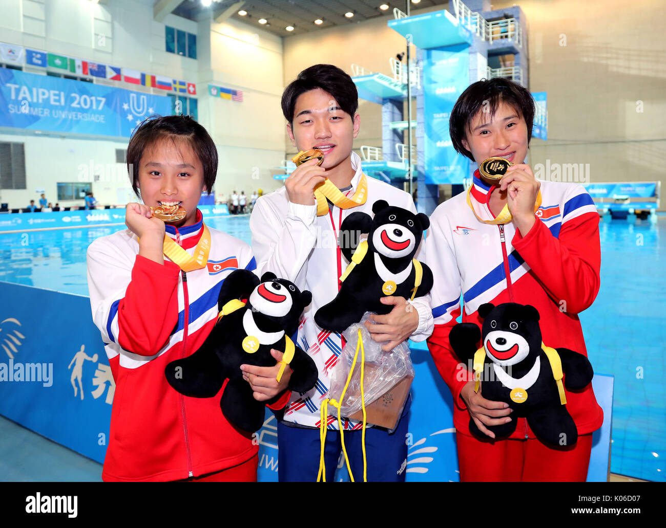 Asiade diving golds South Korean swimmer Kim Yeong-nam (C) poses at a ...