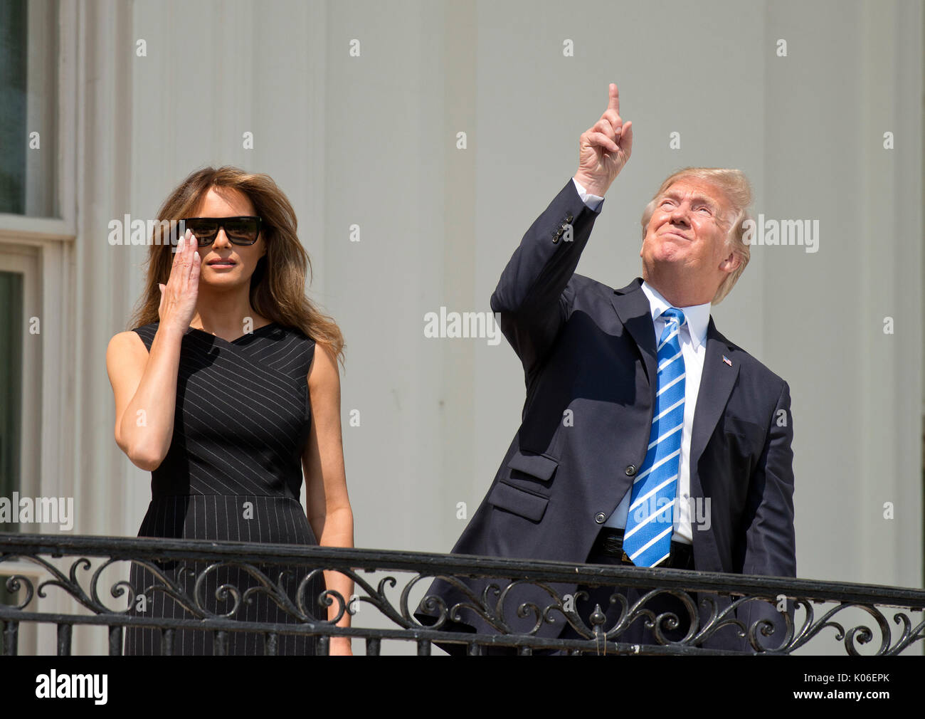 United States President Donald J. Trump, right, points skywards as he ...