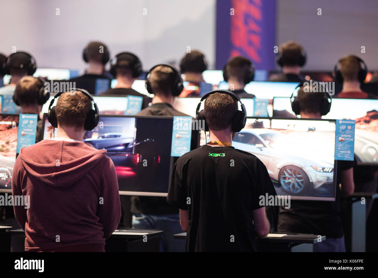 Cologne, Germany. 22nd Aug, 2017. Gamers try out computer games at the ...