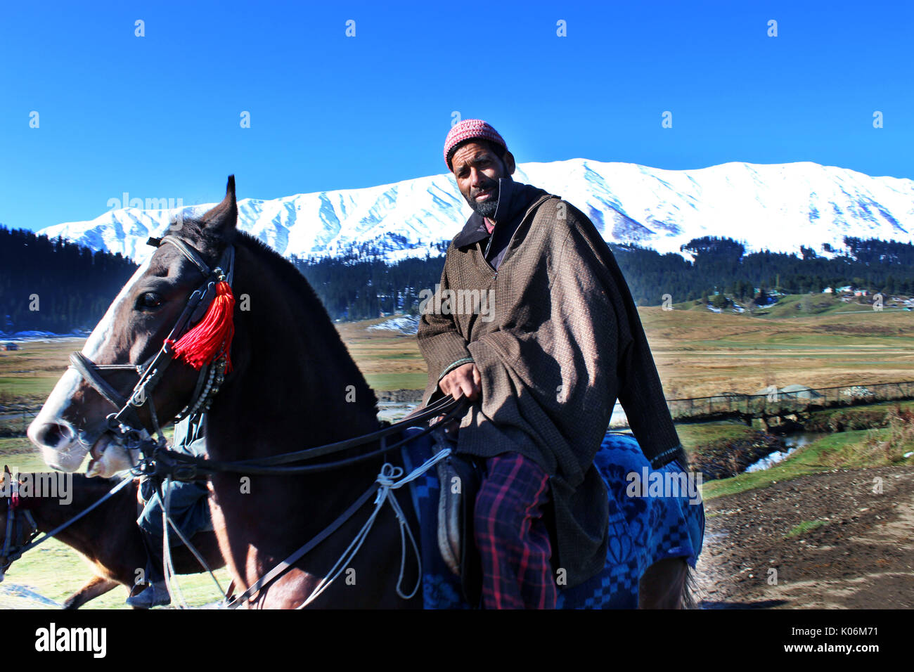 Cowboys riding on their horses at Gulmarg, India. Majestic, adventure ...