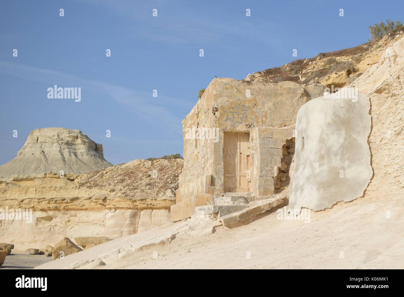 Wooden door built into limestone cliff, Gozo, Malta Stock Photo - Alamy