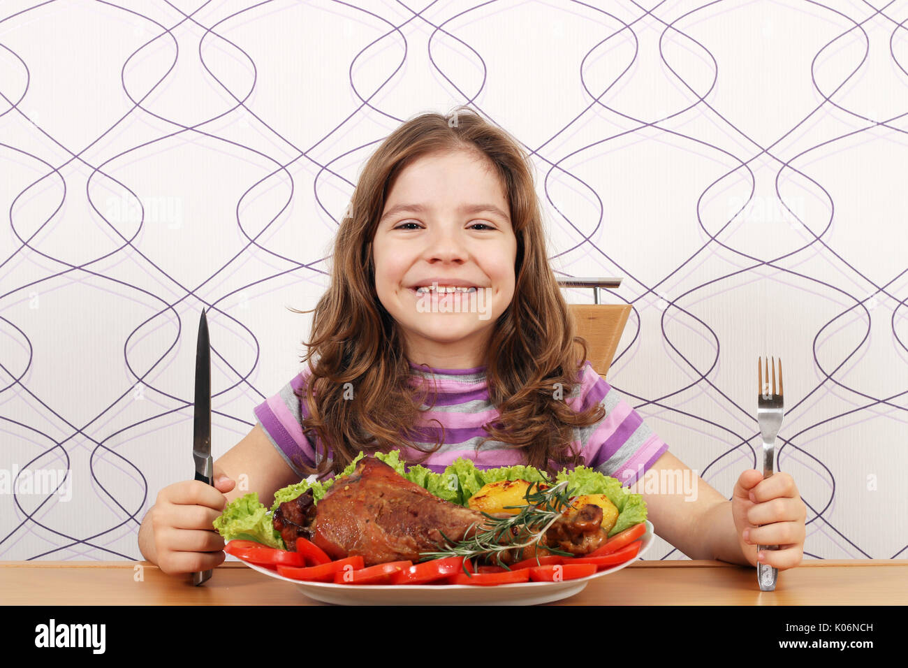 hungry little girl with turkey drumstick Stock Photo - Alamy