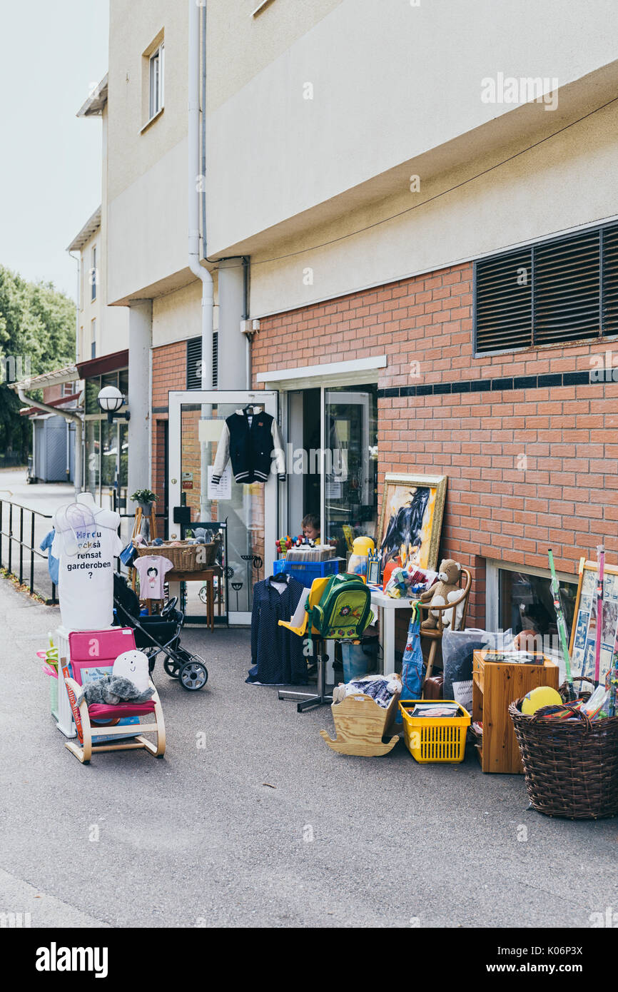 Pre-owned goods on display on sidewalk outside second hand shop ...