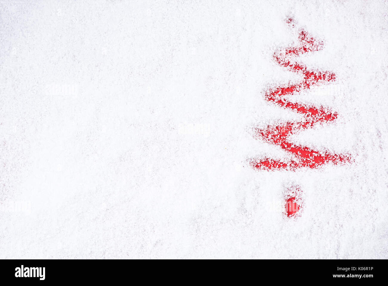 Christmas tree in snow, minimal background Stock Photo - Alamy