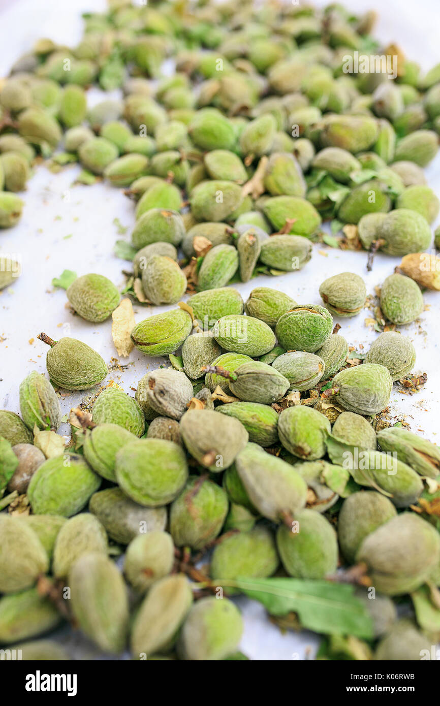 Group of almonds with its skin Stock Photo - Alamy