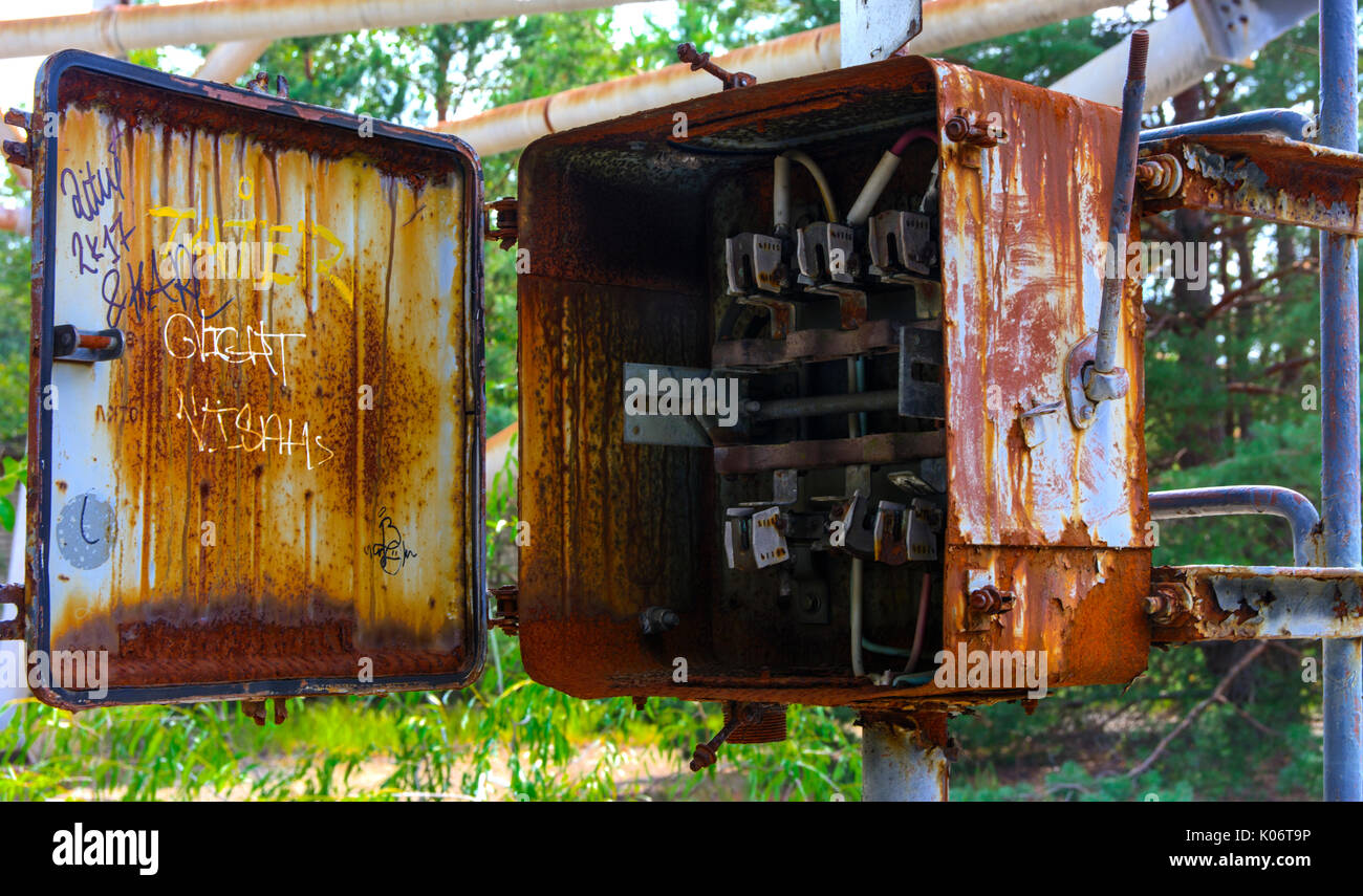 Old rusty junction boxes. Dead military unit. Consequences of the ...