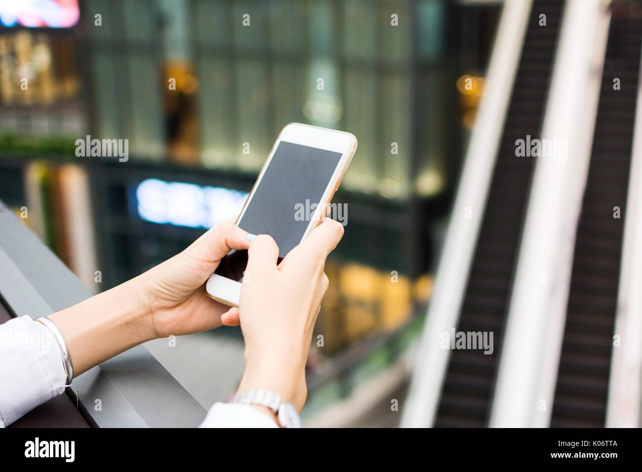 Female hands using smart phone in modern business environment Stock ...