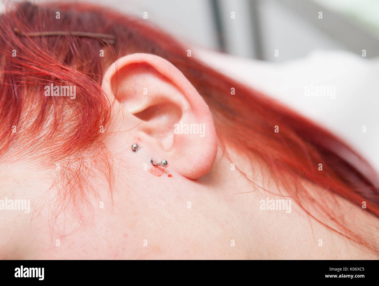 Ear piercings hi-res stock photography and images - Alamy