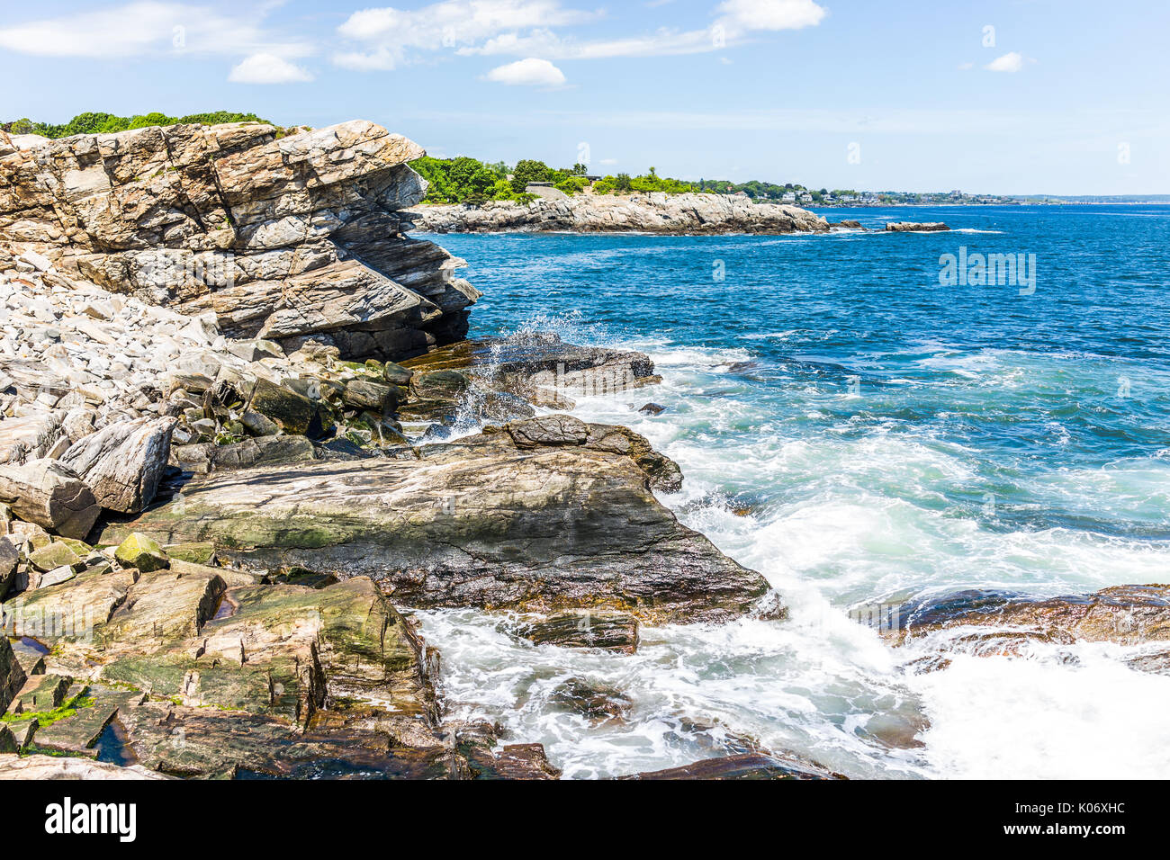 Cliff rocks side view by Portland Head Lighthouse in Fort Williams park ...