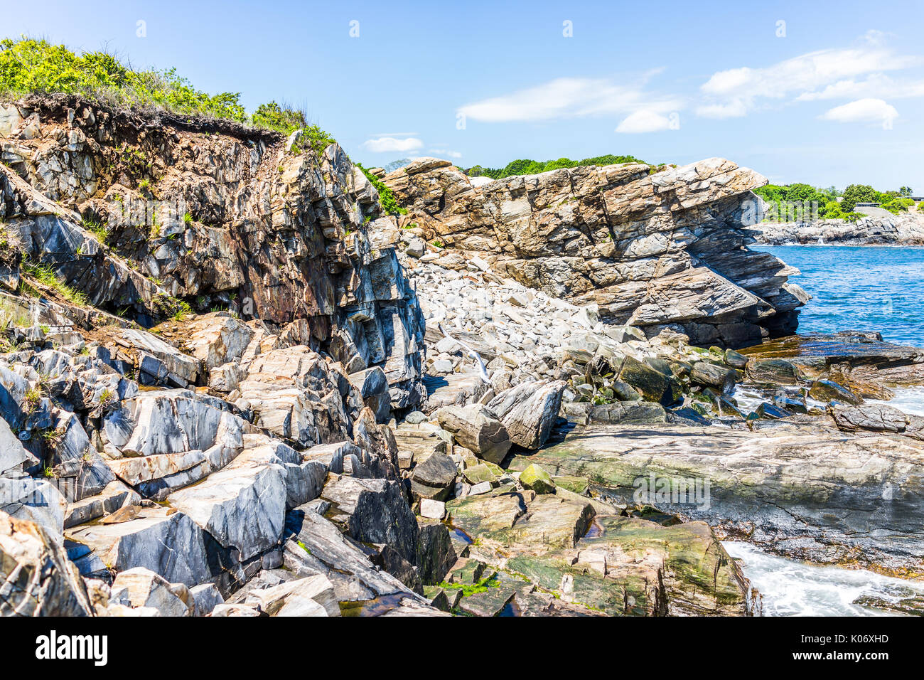 Cliff rocks side view by Portland Head Lighthouse in Fort Williams park ...