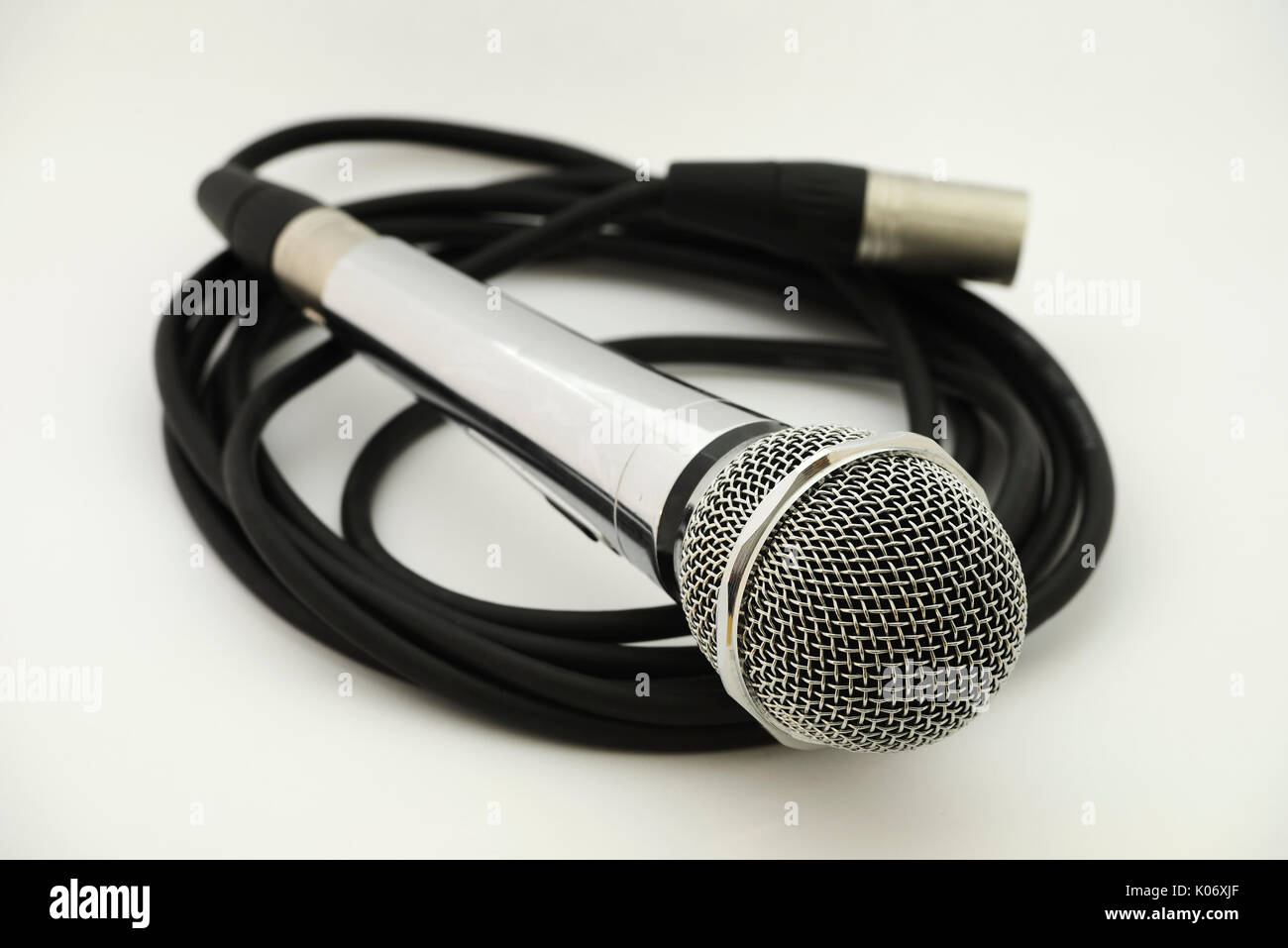 vintage microphone with wire on white background Stock Photo - Alamy