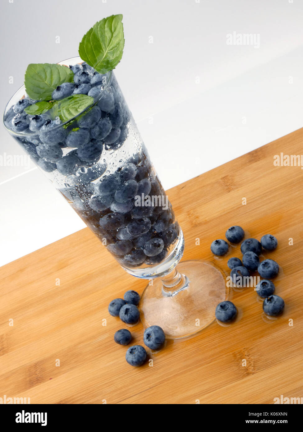 Blueberries in glass of water Stock Photo - Alamy