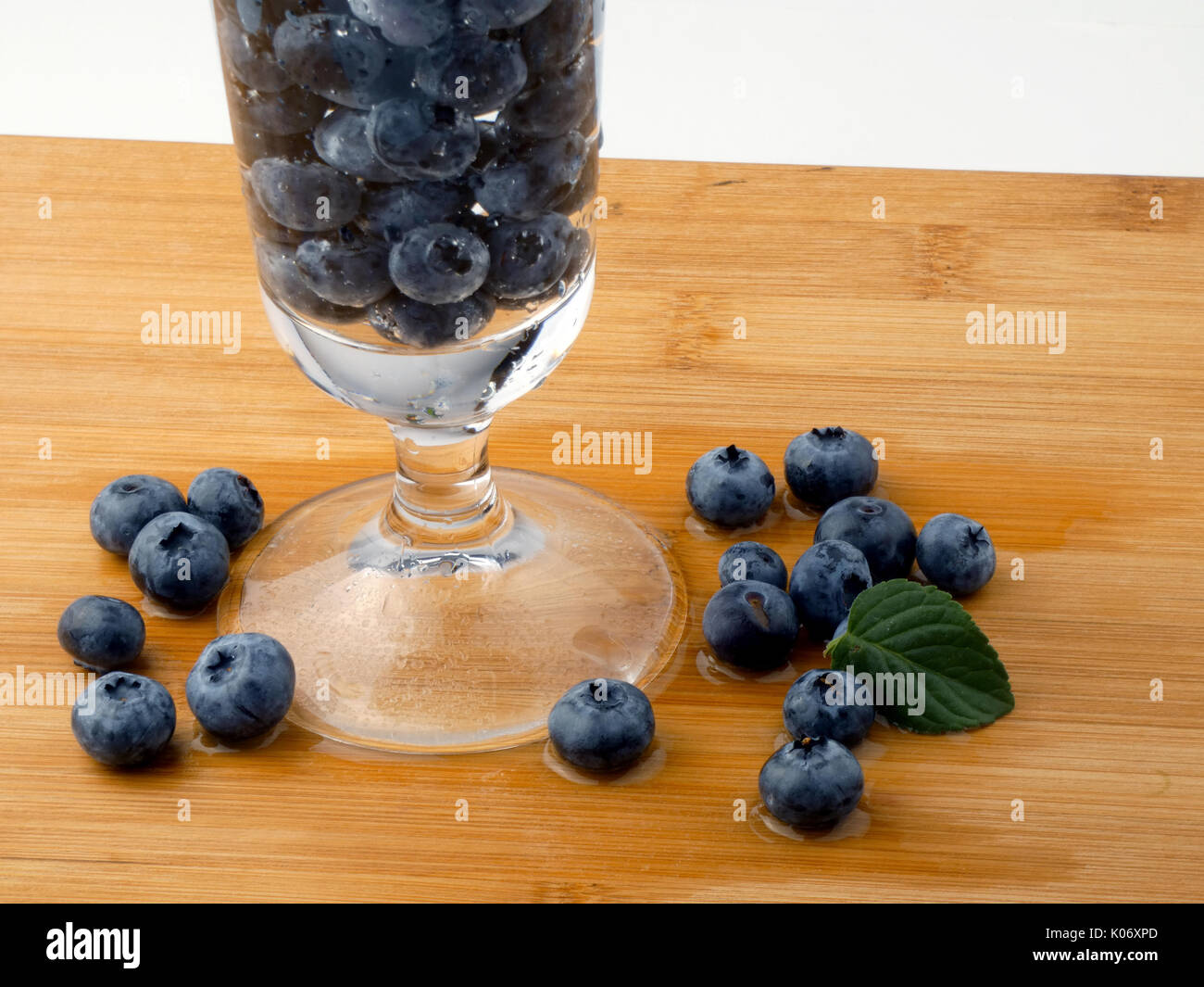 Blueberries in glass of water Stock Photo - Alamy