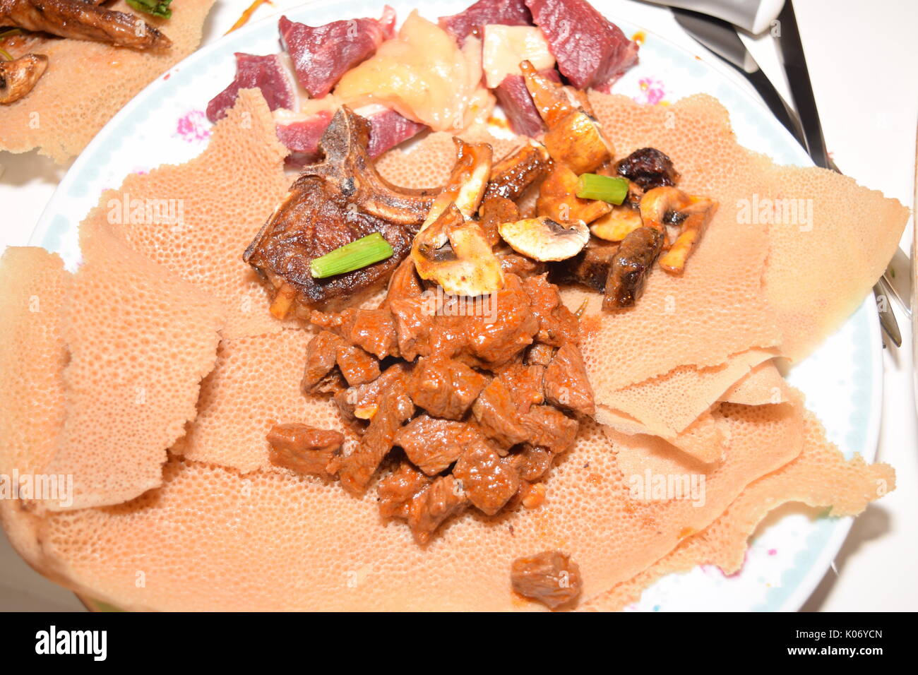 Ethiopian meal served with Injera Stock Photo - Alamy