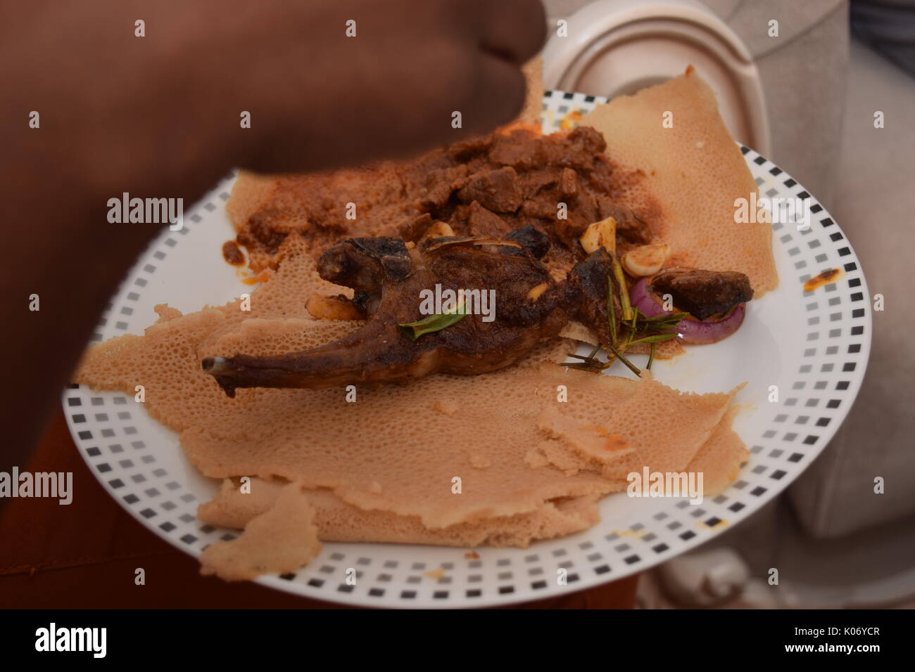 Ethiopian meal served with Injera Stock Photo - Alamy