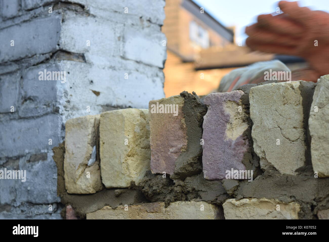 Male worker laying bricks Stock Photo - Alamy