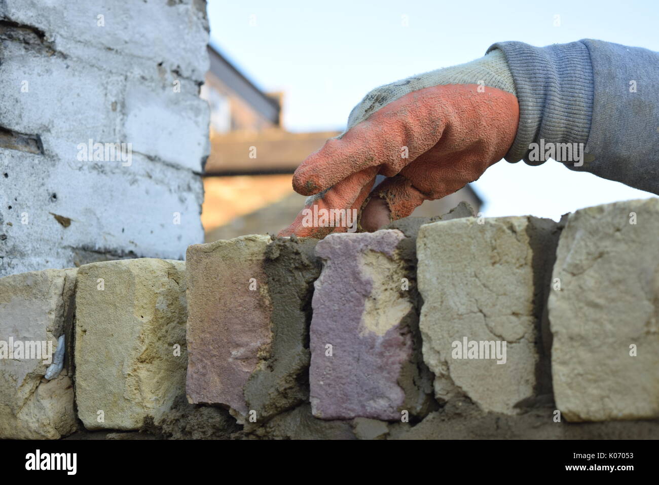 Male worker laying bricks Stock Photo - Alamy