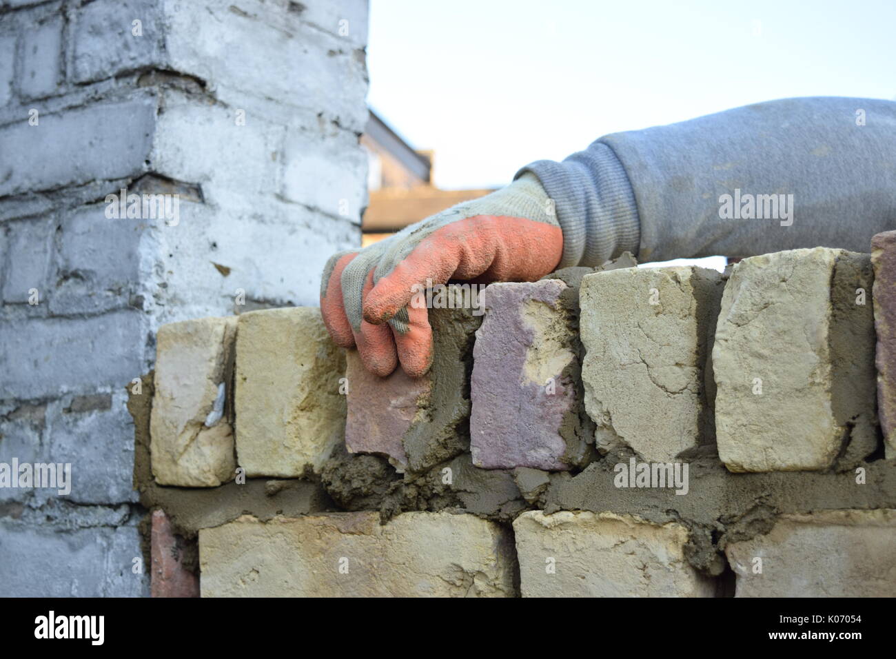 Male worker laying bricks Stock Photo - Alamy
