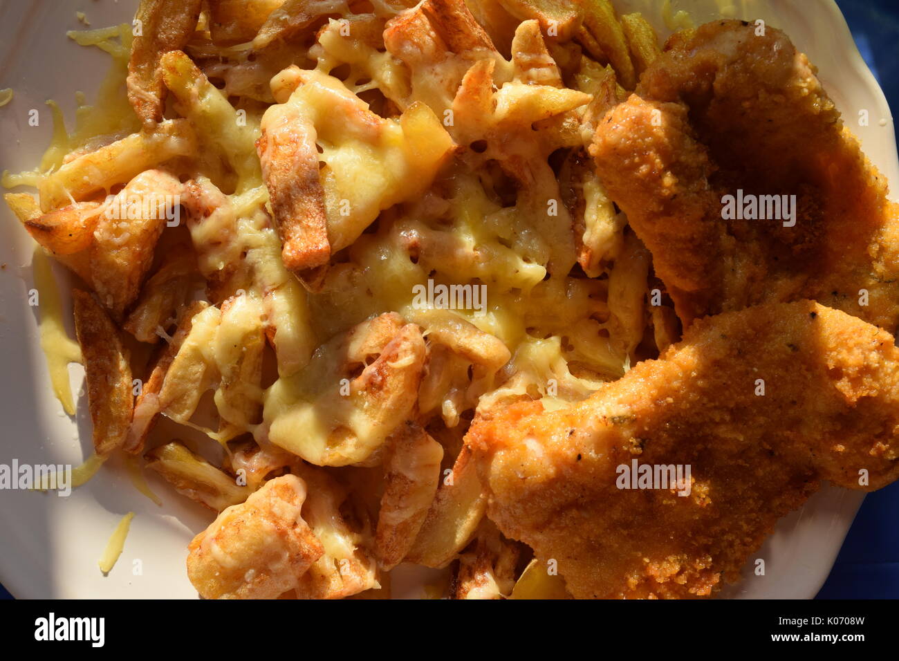 Cheese covered fries hi-res stock photography and images - Alamy