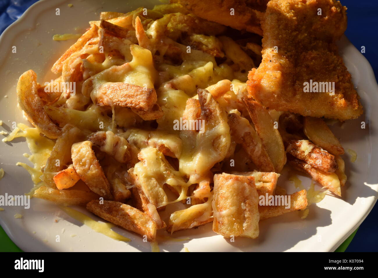 Cheese covered fries hi-res stock photography and images - Alamy