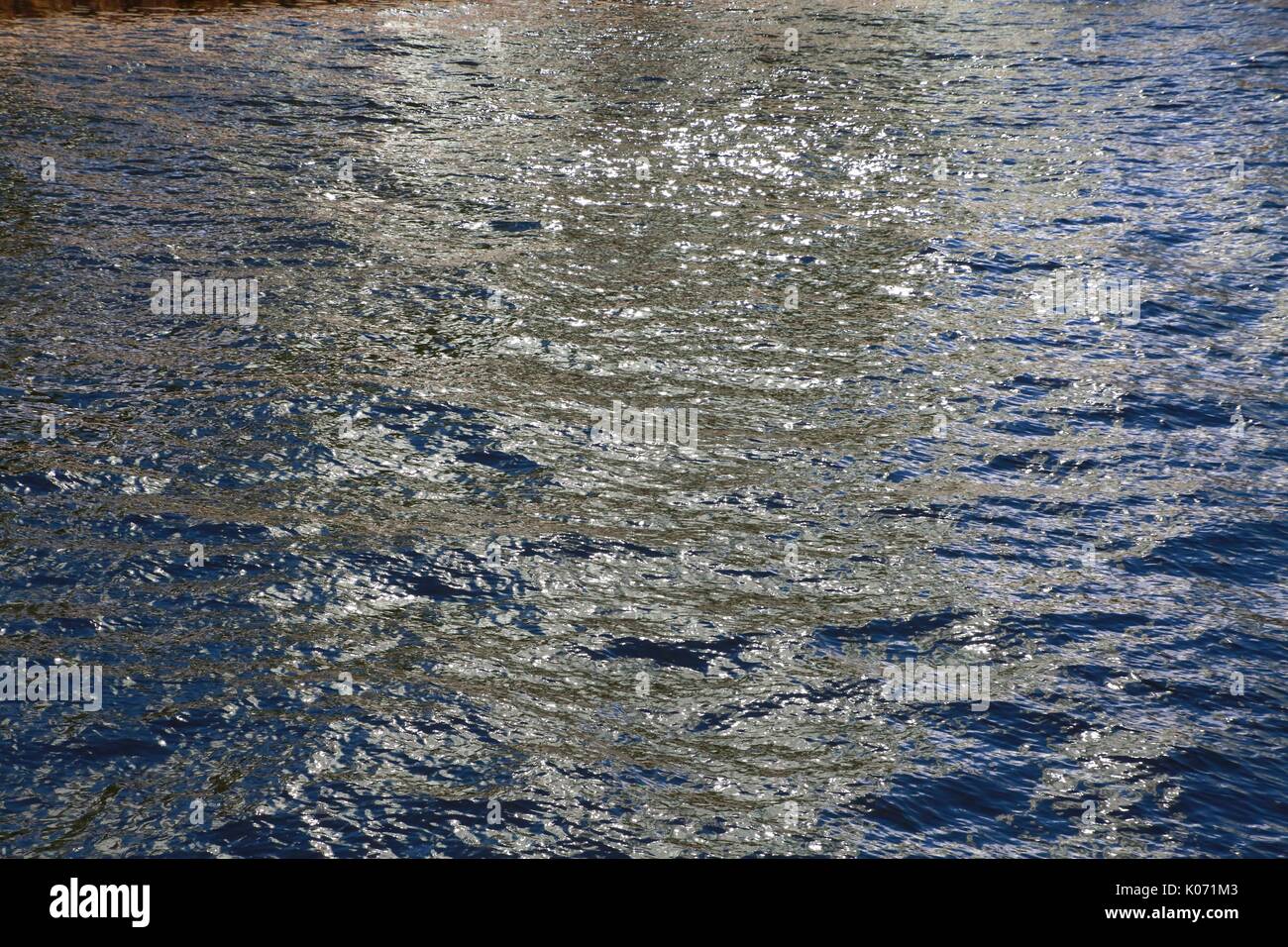 Sparkling Sunlit Water Ripples Stock Photo - Alamy