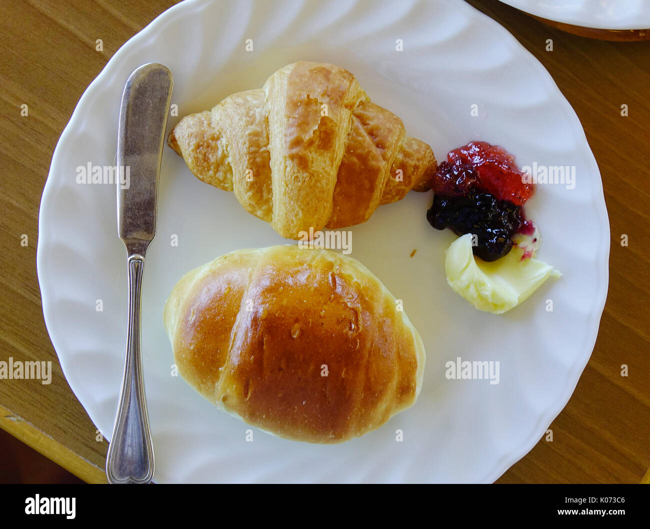 Western breakfast with bread, butter and jam. Close up Stock Photo - Alamy