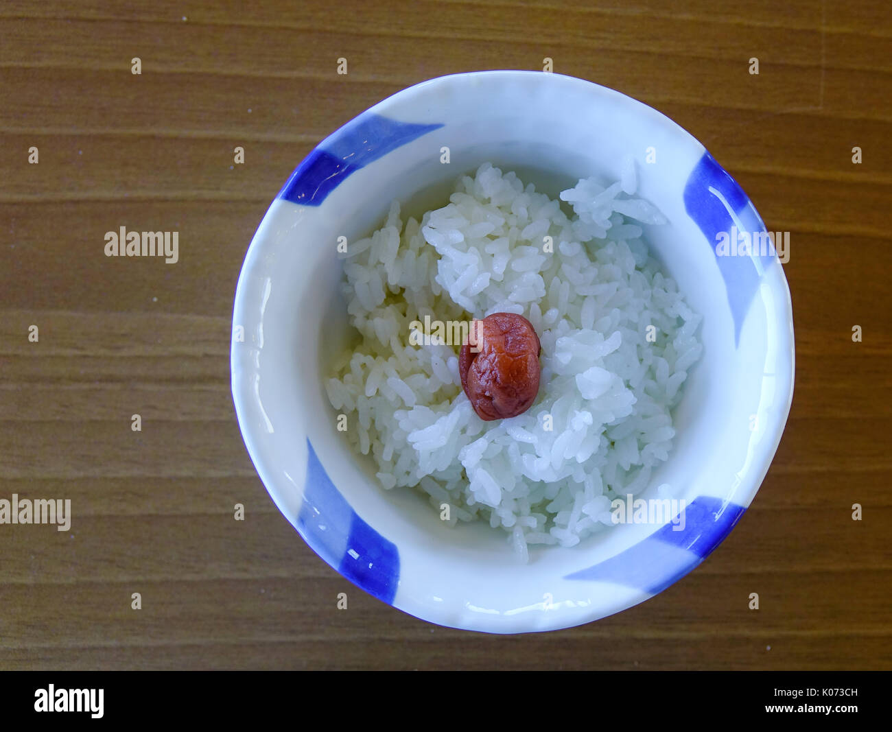 Japanese white rice and umeboshi (plum pickle) on wooden table Stock ...