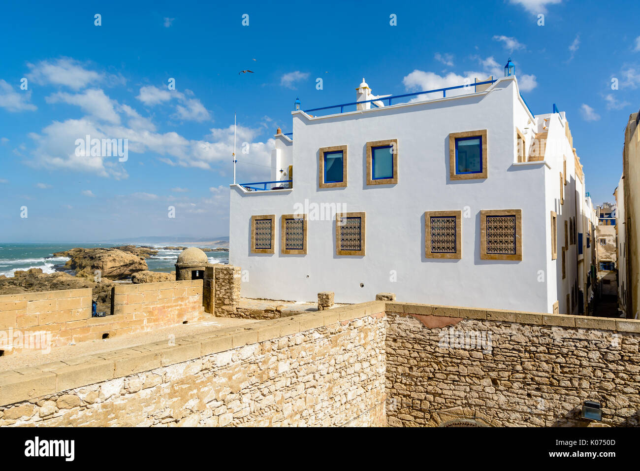 A typical white Moroccan house built on the fortress in Essaouira ...
