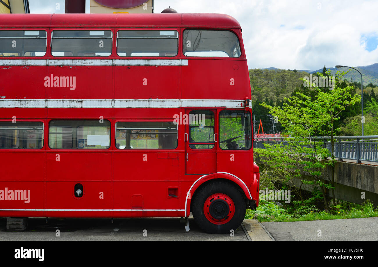 Vintage red bus at the station - British style double-deck public bus ...
