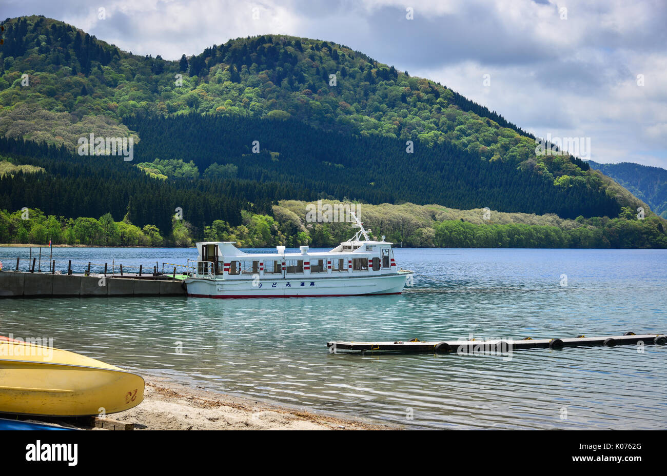 Akita, Japan - May 17, 2017. A jetty at Lake Tazawa with mountains in ...
