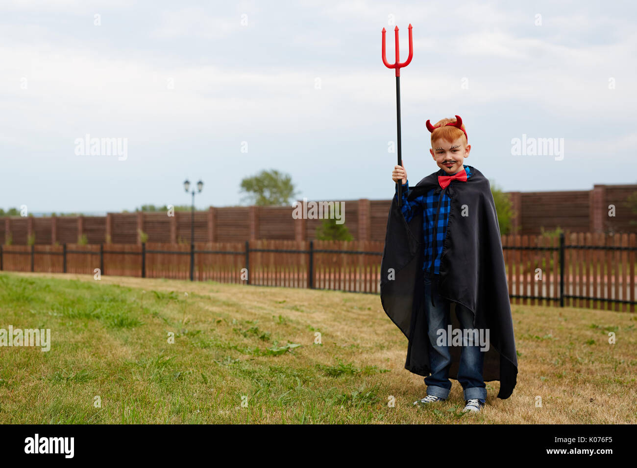 Child boy devil horns trident hi-res stock photography and images - Alamy