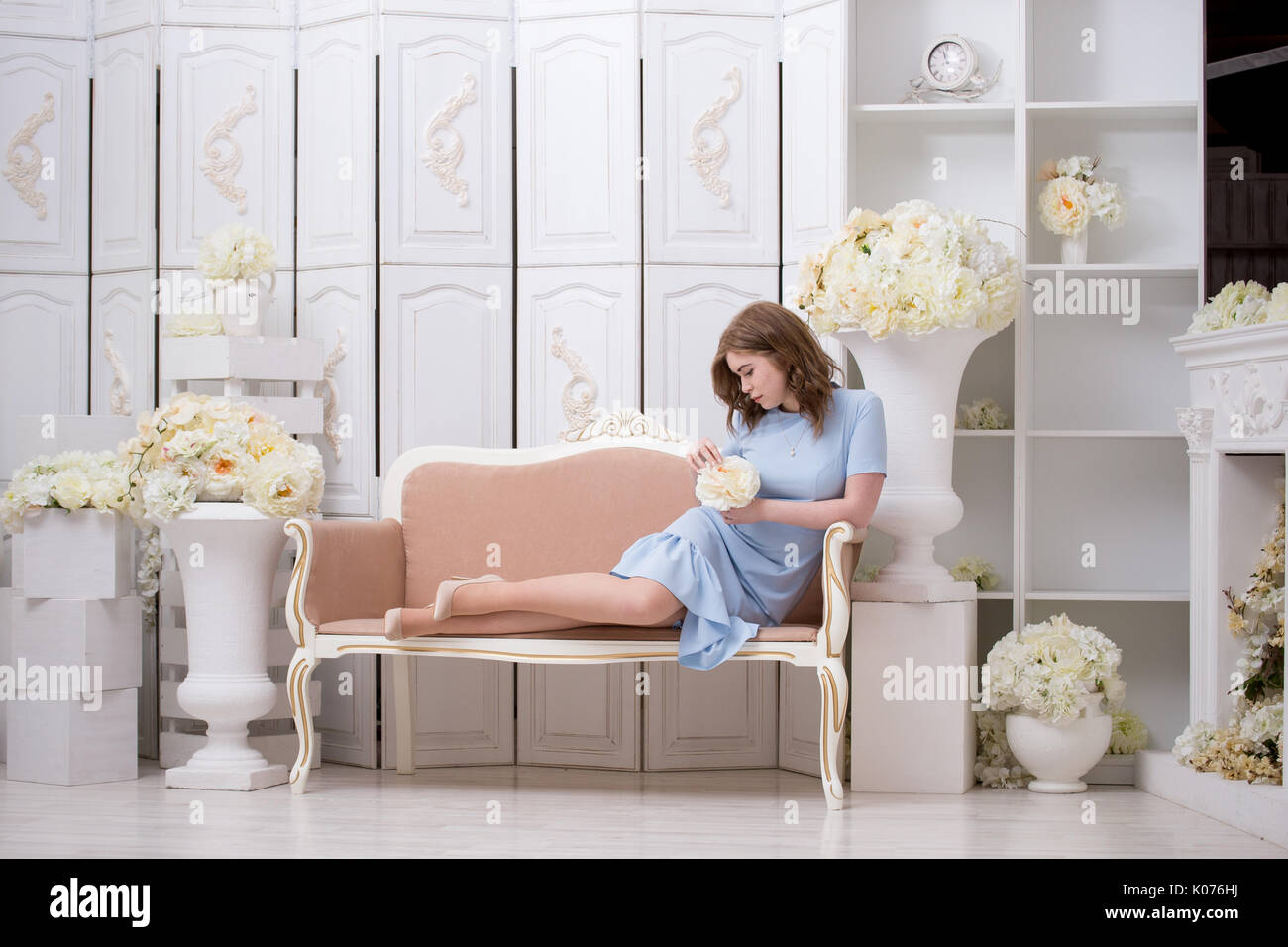 Charming young girl on a studio photo shoot Stock Photo - Alamy