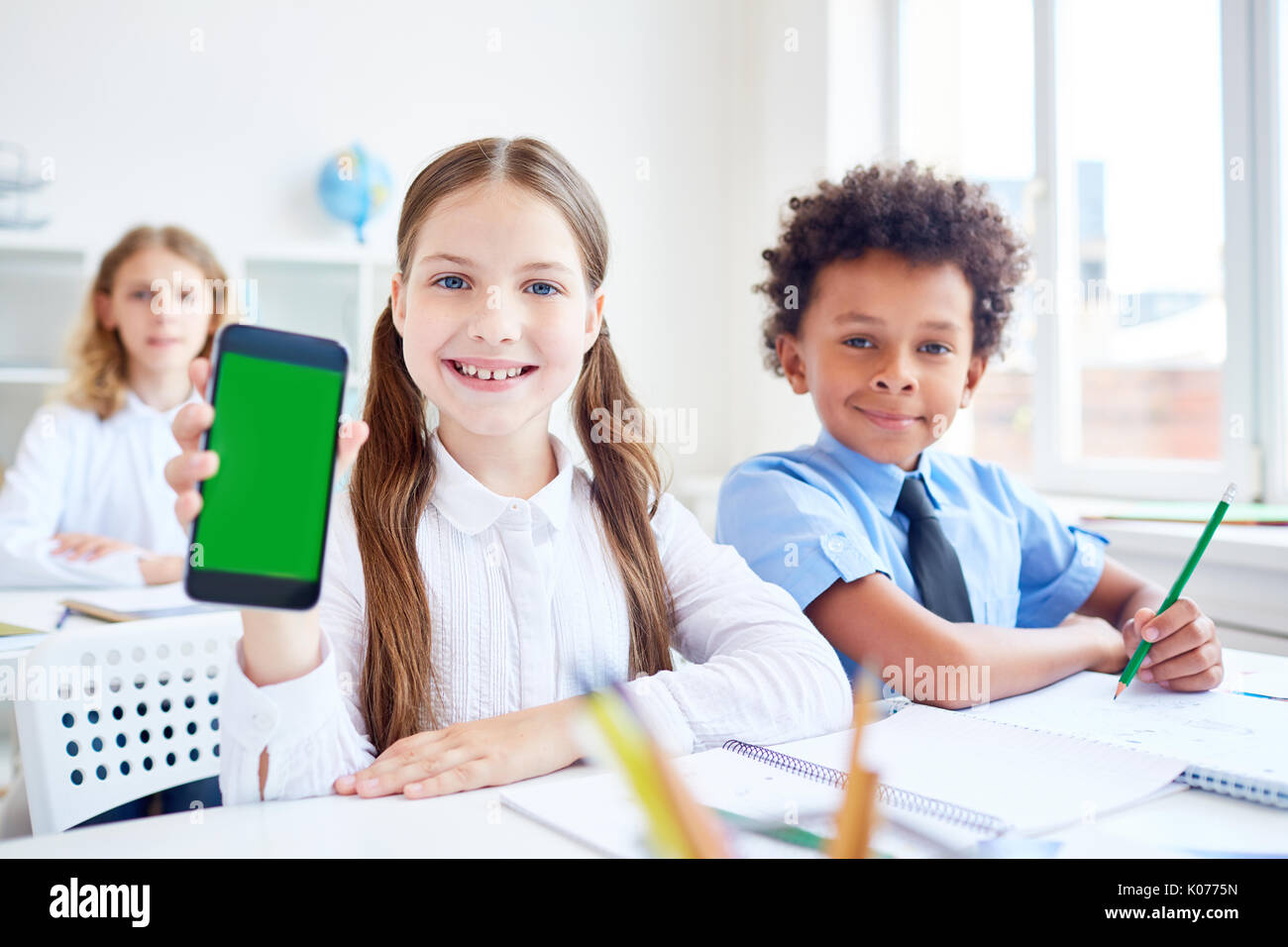 Schoolgirl with gadget Stock Photo - Alamy