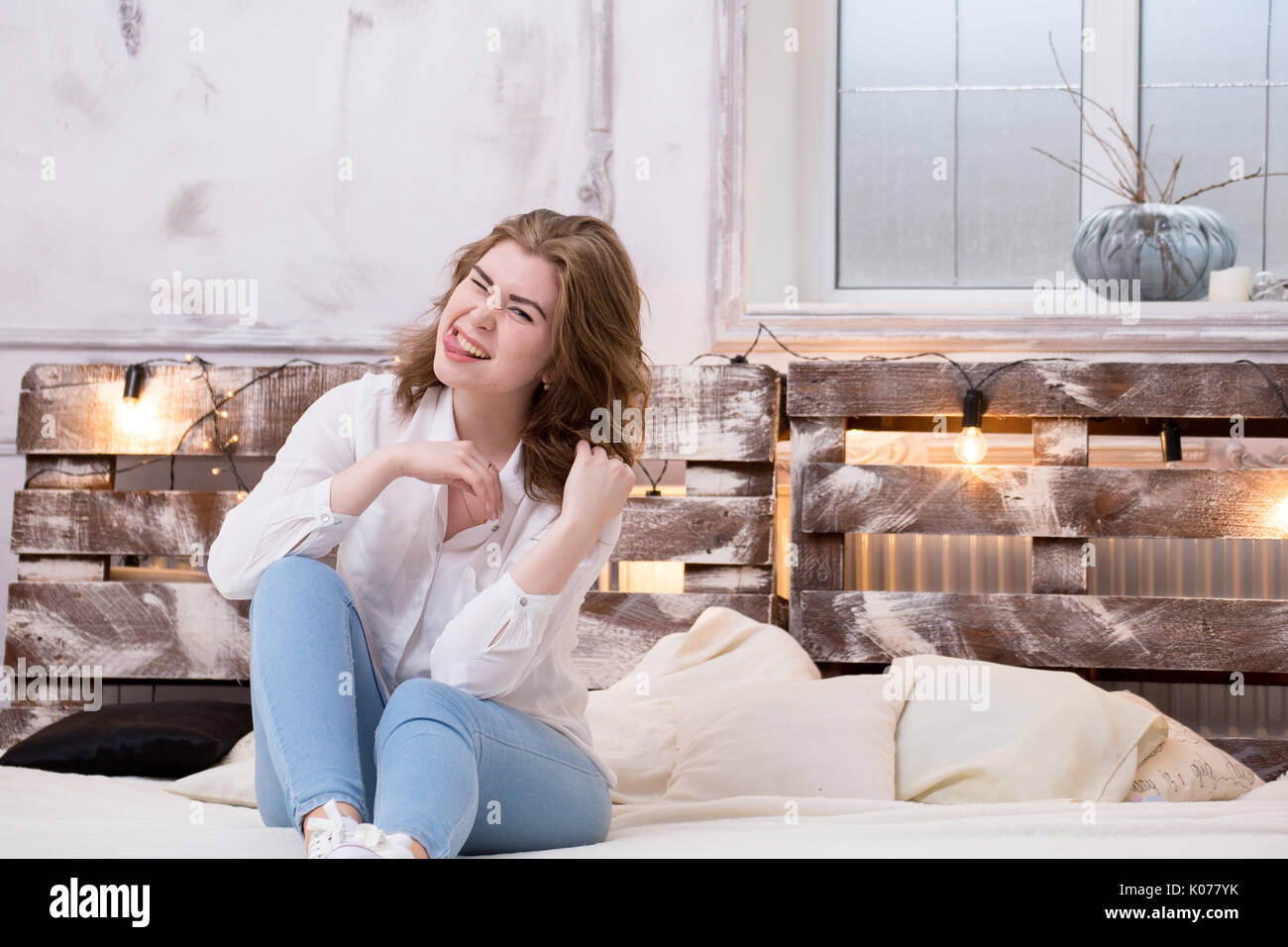 Charming young girl on a studio photo shoot Stock Photo - Alamy