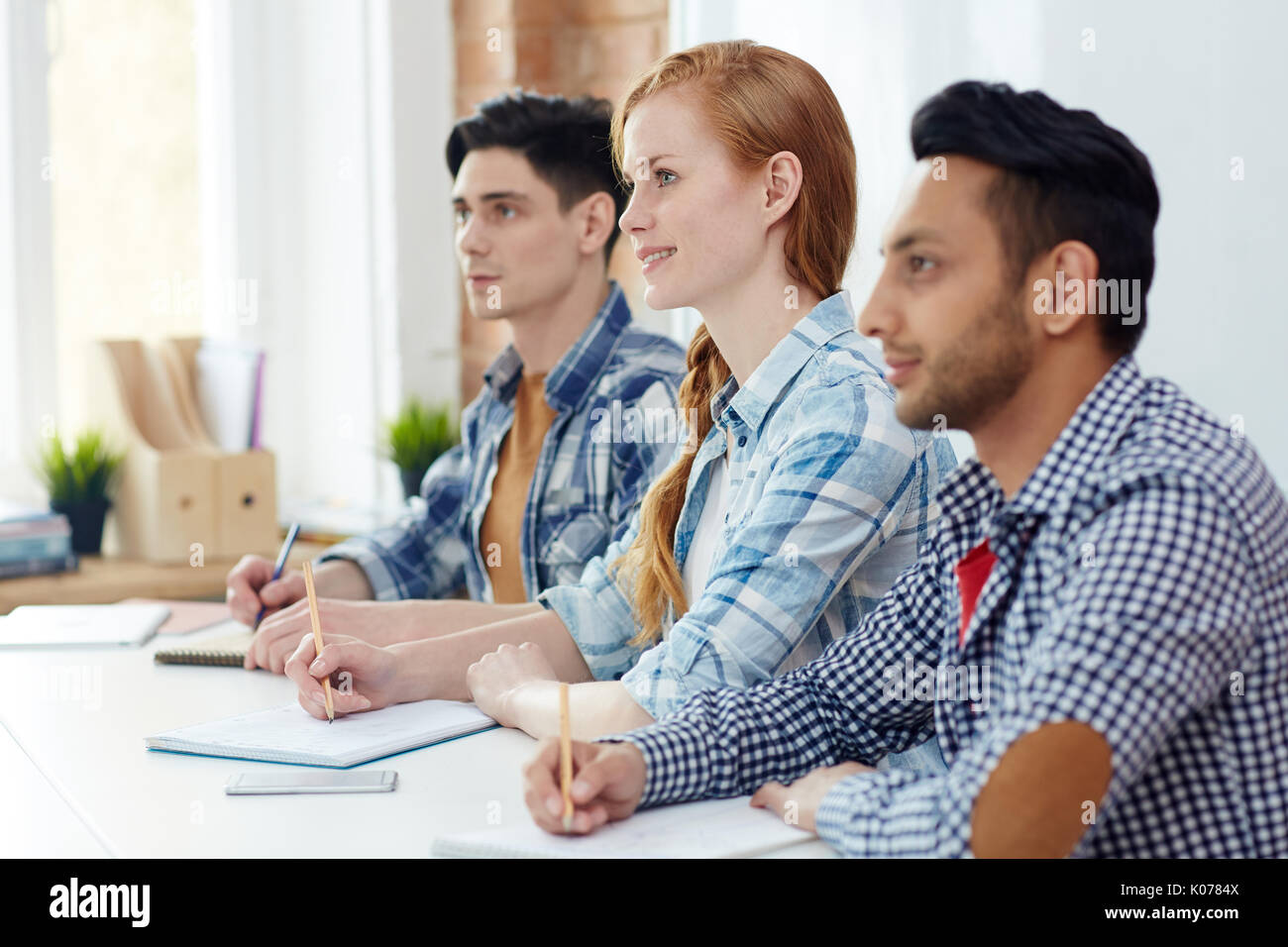 Looking at board Stock Photo - Alamy