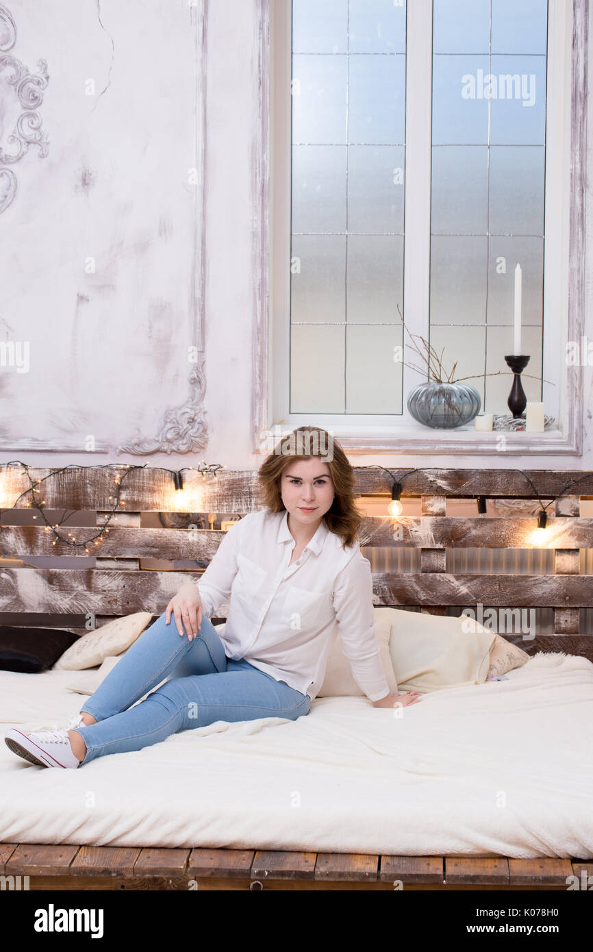 Charming young girl on a studio photo shoot Stock Photo - Alamy